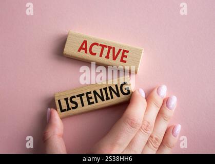Active listening symbol. Wooden blocks with words Active listening ...