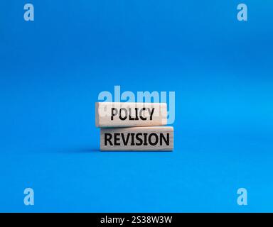 Policy revision symbol. Concept word Policy revision on wooden blocks ...