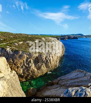 Spring evening Atlantic Ocean coastline landscape with sun reflection ...