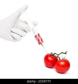 Gmo product concept: Tomato injection isolated Stock Photo - Alamy