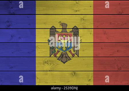 Moldova flag depicted in bright paint colors on old wooden wall close ...