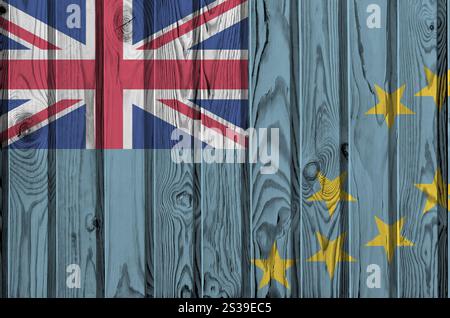 Tuvalu flag depicted in bright paint colors on old wooden wall close up ...