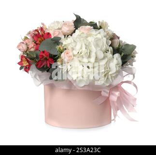 Beautiful alstroemeria flowers and gift box on table near color wall ...