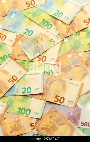 Close-up of a group of euro bills arranged on top of each other on a ...