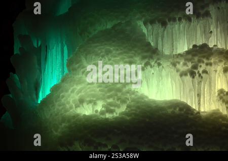 Huge ice icicles. Fragment of large blocks of ice frozen waterfall of ...