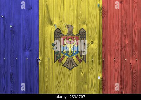 Moldova flag depicted in bright paint colors on old wooden wall close ...