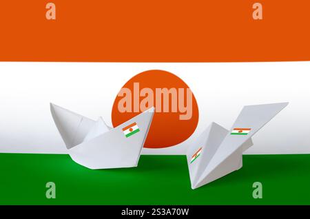 Niger flag depicted on paper origami crane wing. Oriental handmade arts ...