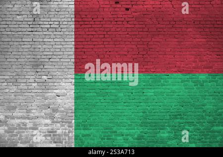 Madagascar flag depicted in paint colors on old stone wall close up ...