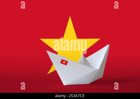 Vietnam flag depicted on paper origami ship closeup. Oriental handmade ...