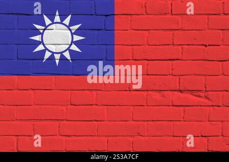 Taiwan flag depicted in paint colors on old stone wall close up ...