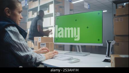 Female Postal Warehouse Associate Works on Computer in Delivery Service ...