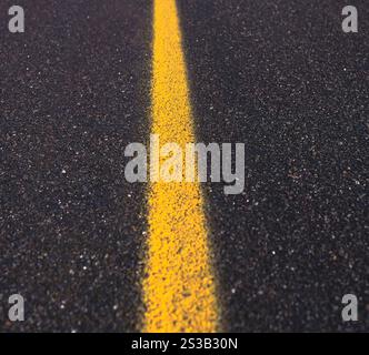 Asphalt road texture with yellow stripe Stock Photo - Alamy