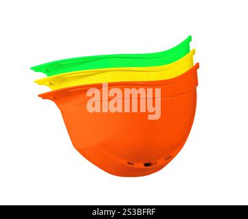 Yellow, red, and green safety helmets on white background. Yellow, red ...