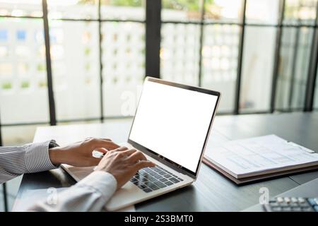 Mockup image of laptop computer with blank white desktop screen on ...