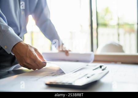 Young businessman with helmet drawing on virutal screen Stock Photo - Alamy