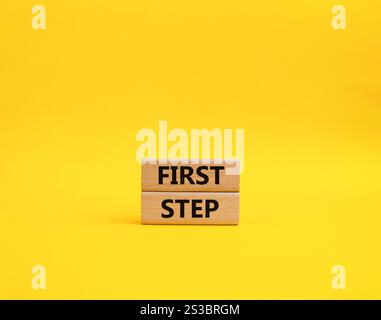 Make first step symbol. Wooden blocks with words First step is the ...