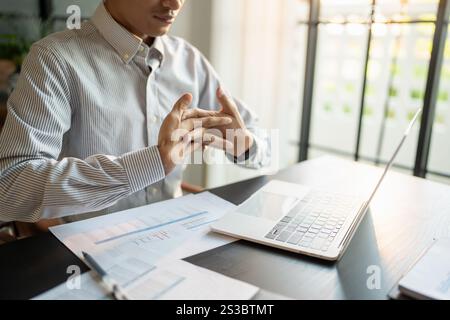 Businessman Stretch hand muscles before working long time. Tired ...