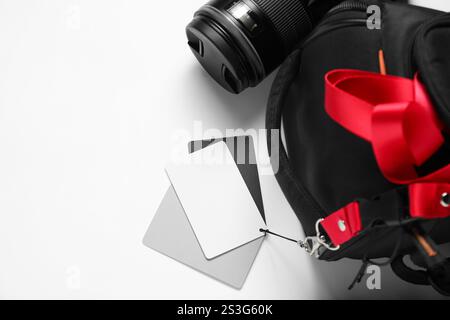 White balance calibration cards and camera on red background Stock ...