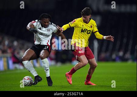 Fulham's Adama Traore and Watford's Rocco Vata (right) battle for the ...