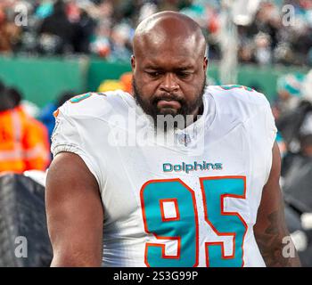 Miami Dolphins defensive tackle Benito Jones (95) yells as he runs onto ...
