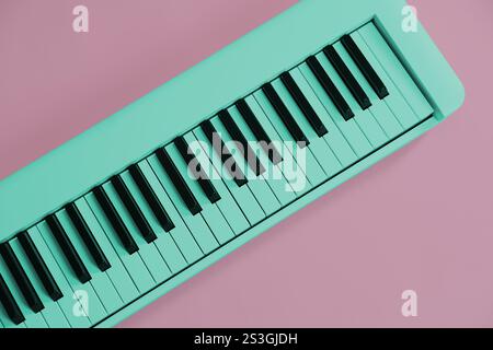 Synthesizer on pink background, top view. Electronic musical instrument ...