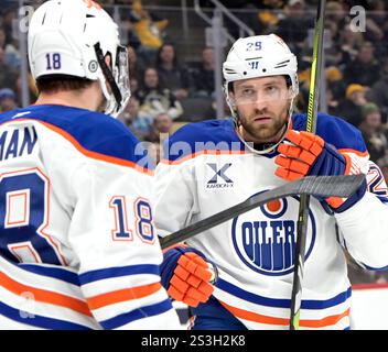 Edmonton Oilers' Zach Hyman (18) controls the puck in front of Carolina ...