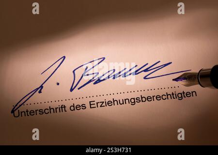Handwritten signature under an official document of the school Stock ...