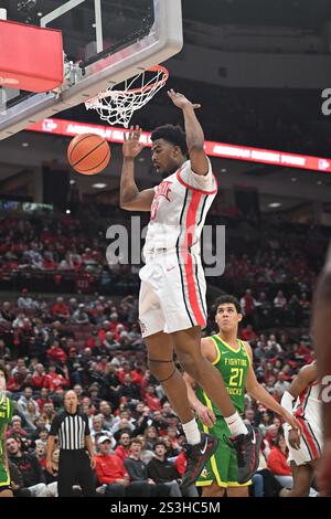Ohio State forward Sean Stewart dunks in front of Michigan center Danny ...