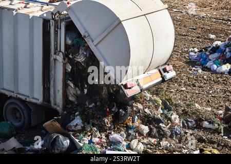 Truck unloading garbage on an open air dump. Waste recycling Stock ...