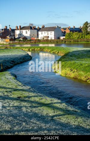 The river Wheelock in flood running through the Cheshire village of ...