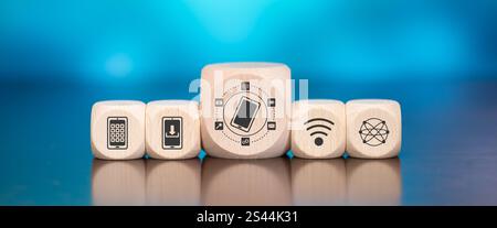 Wooden blocks with symbol of mobile apps concept on blue background ...
