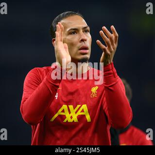 Virgil van Dijk of Liverpool applauds the fans after the final whistle ...