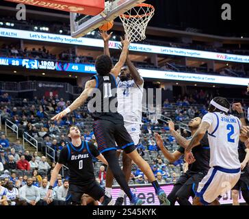 DePaul guard CJ Gunn (11) guards Marquette forward Ben Gold (12) during ...