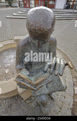 Sculpture Book reader at the fountain in front of the town library ...