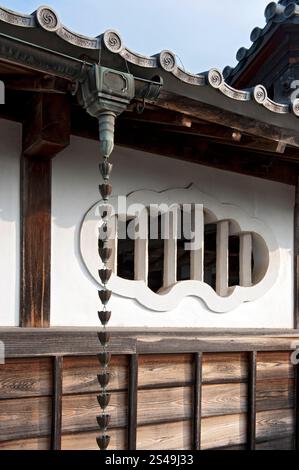 A Japanese rain chain or kusari-doi which is a traditional rain ...