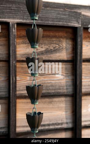 A Japanese rain chain or kusari-doi which is a traditional rain ...