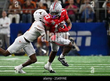 Ohio State receiver Carnell Tate plays against Texas during an NCAA ...