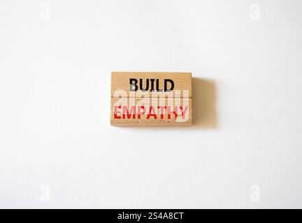 Build empathy symbol. Wooden blocks with words Build empathy ...
