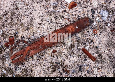 A rusty piece of metal laying on the ground Stock Photo - Alamy
