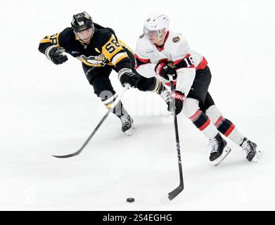 Ottawa Senators' Tim Stutzle (18) laughs after falling on the ice ...
