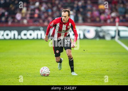 #24, Mikkel Damsgaard of Brentford in attacking action shadowed by #5 ...