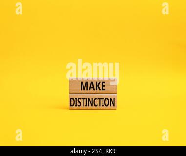 Make distinction symbol. Concept words make distinction on wooden ...