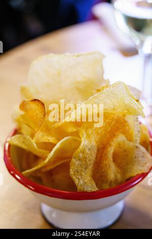 Presentation of a plate of homemade potato chips Stock Photo - Alamy
