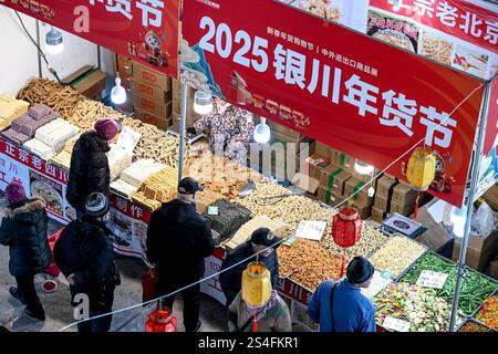 Citizens shop for New Year decorations at a supermarket in Nanjing City ...