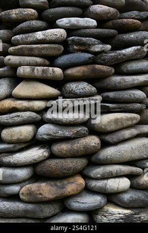 Background of pebbles on wall Stock Photo - Alamy