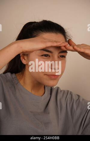 This gesture expresses a desire to protect oneself. It symbolizes ...