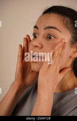 surprised impressed girl facial expression emotion Stock Photo - Alamy