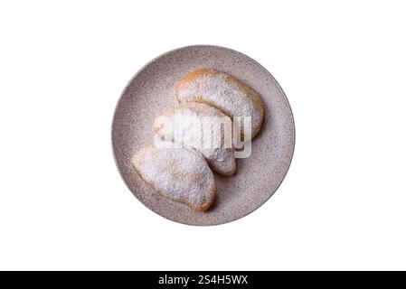 Sweet dumplings with fruits and berries sprinkled with powdered sugar ...