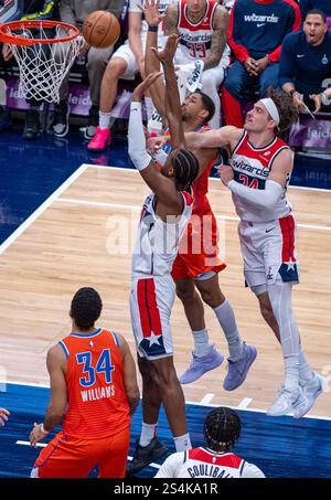 Oklahoma City Thunder guard Aaron Wiggins (21) drives against Brooklyn Nets forward Tosan ...