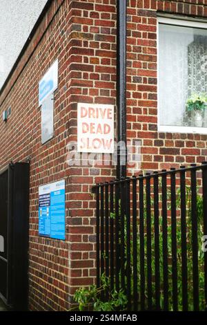 Residential street sign, drive slow Stock Photo - Alamy